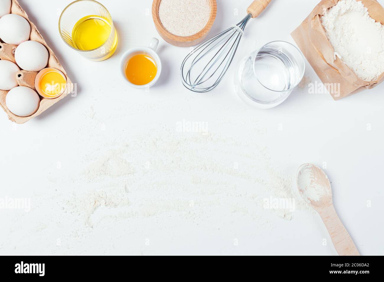 Flat lay homemade baking ingredients and kitchen utensils on white ...