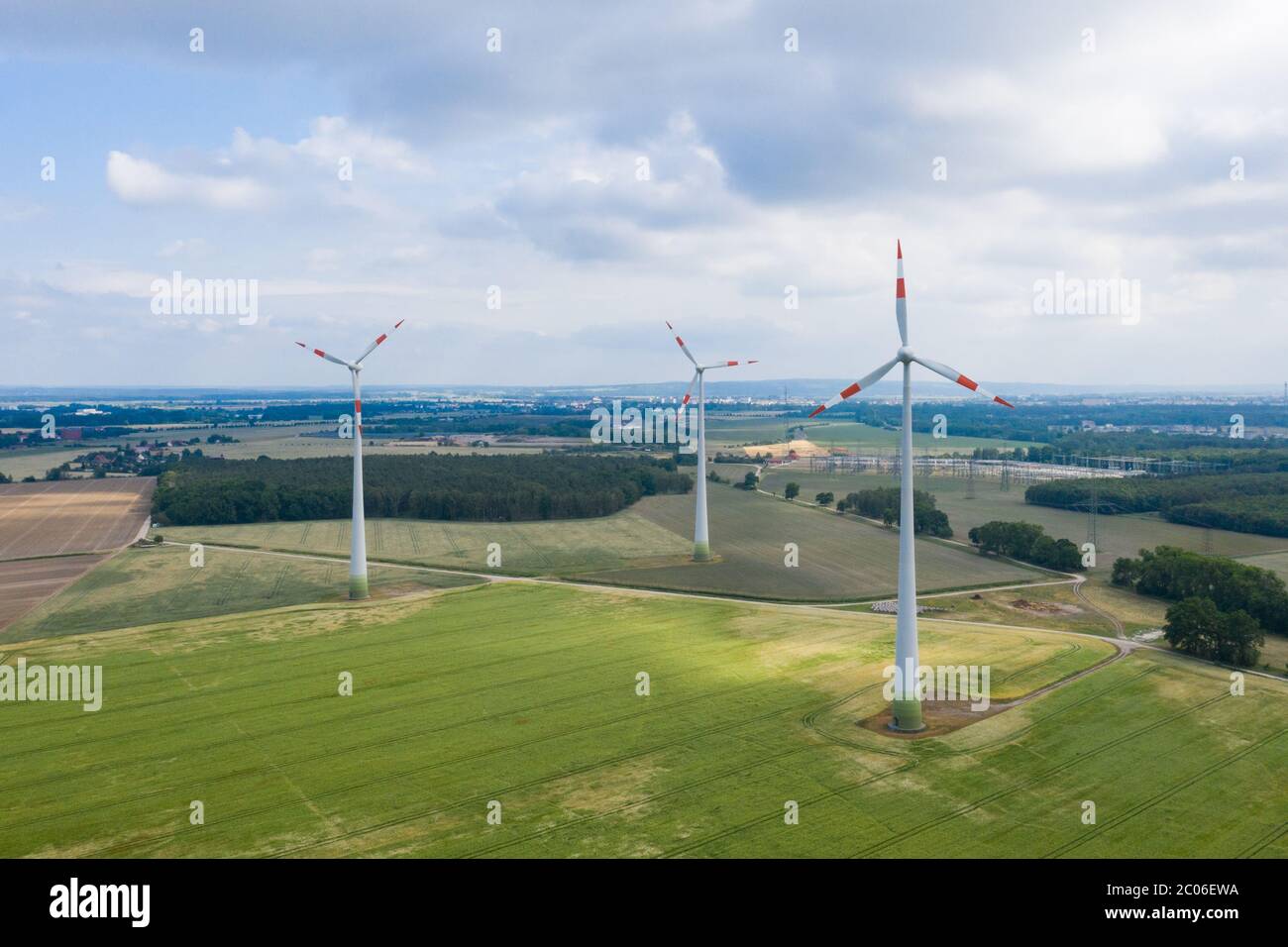 11 June 2020, Brandenburg, Schwedt/Oder: Three wind turbines are ...