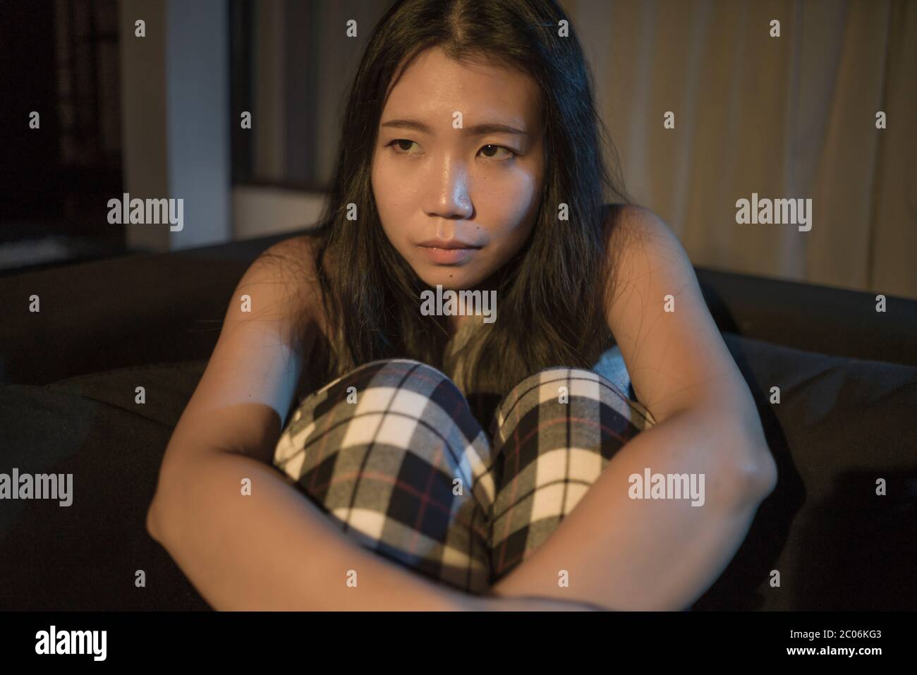 Dramatic Home Lifestyle Portrait Of Young Beautiful Sad And Depressed