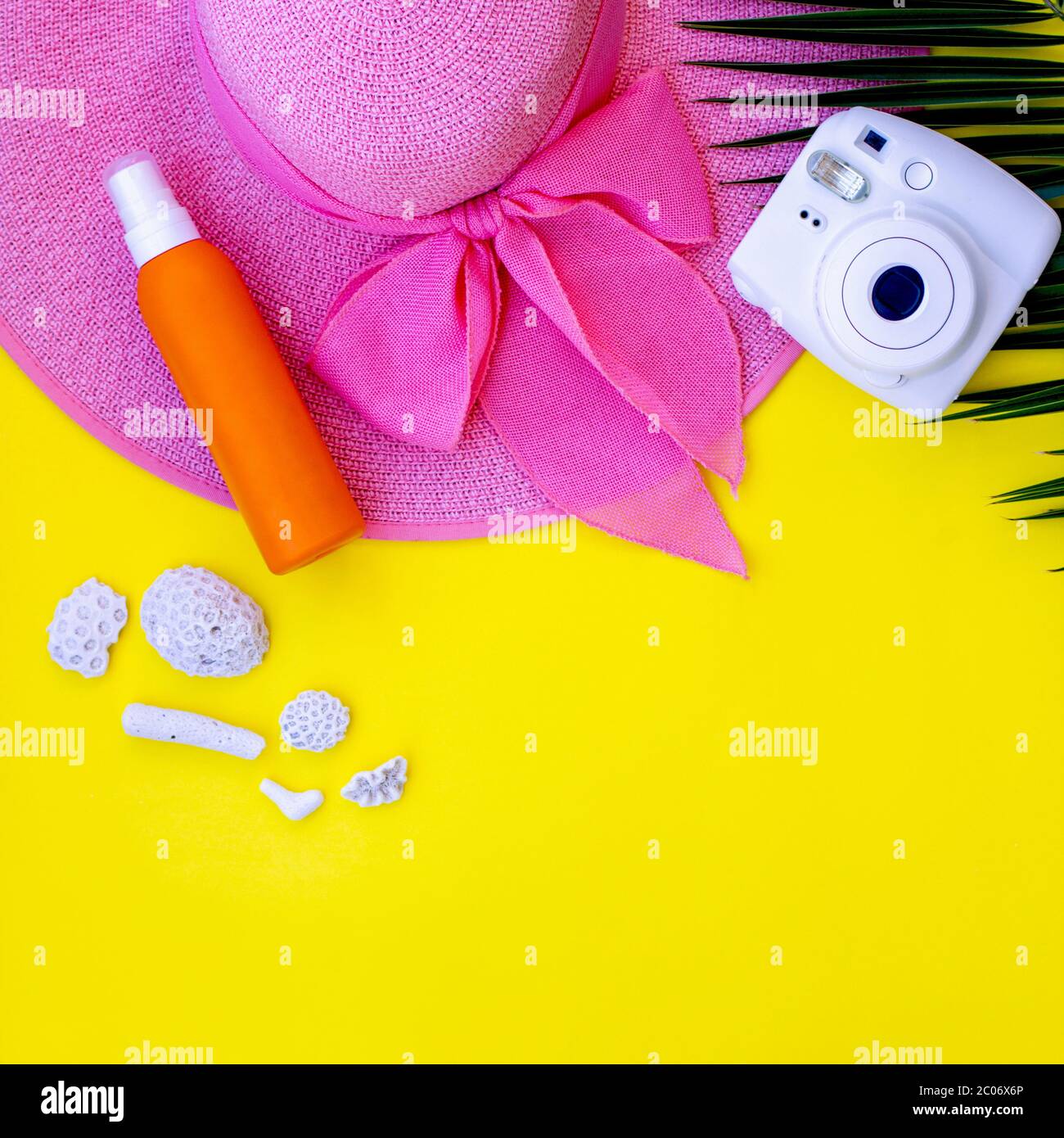 Summer set of beach items on a yellow background Stock Photo - Alamy