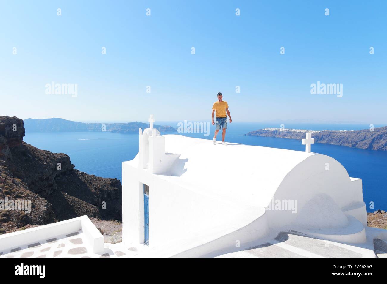 Santorini greece, young men on a luxury vacation at the Greek Island of ...
