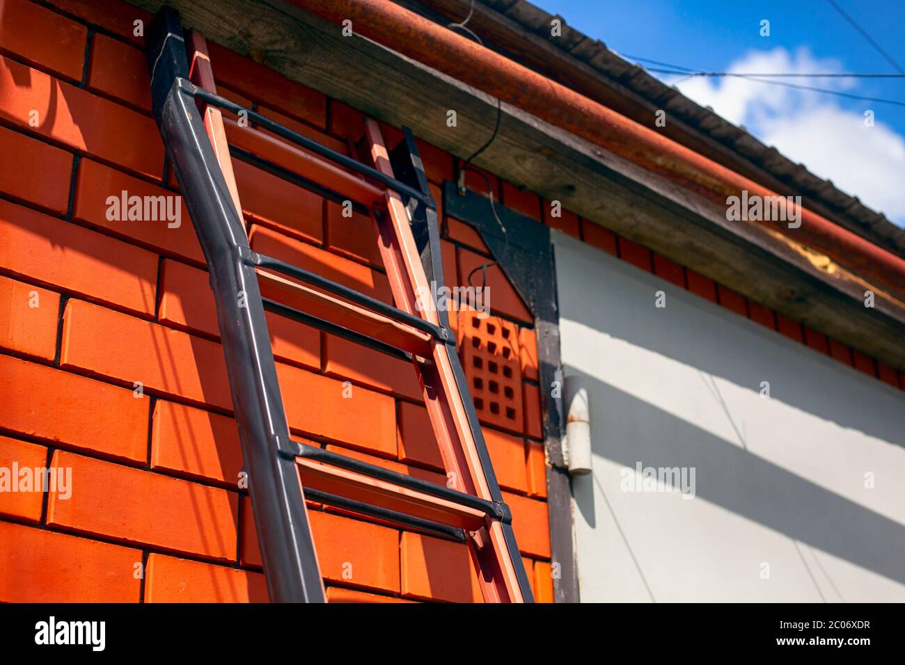 Step ladder near brick wall outdoors Stock Photo - Alamy