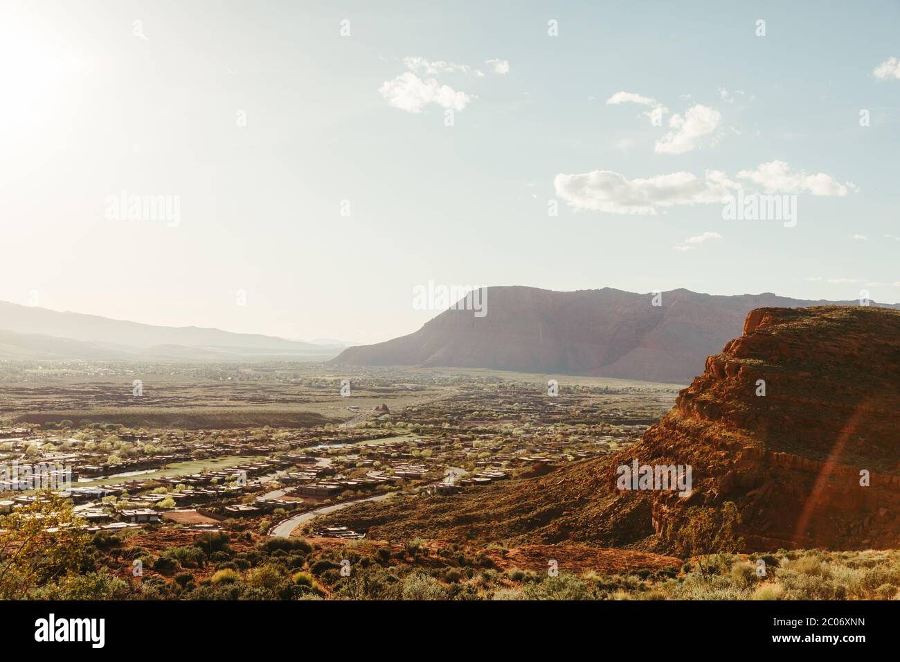 sun sets over suburbs housing projects on outskirts of St. George Utah ...