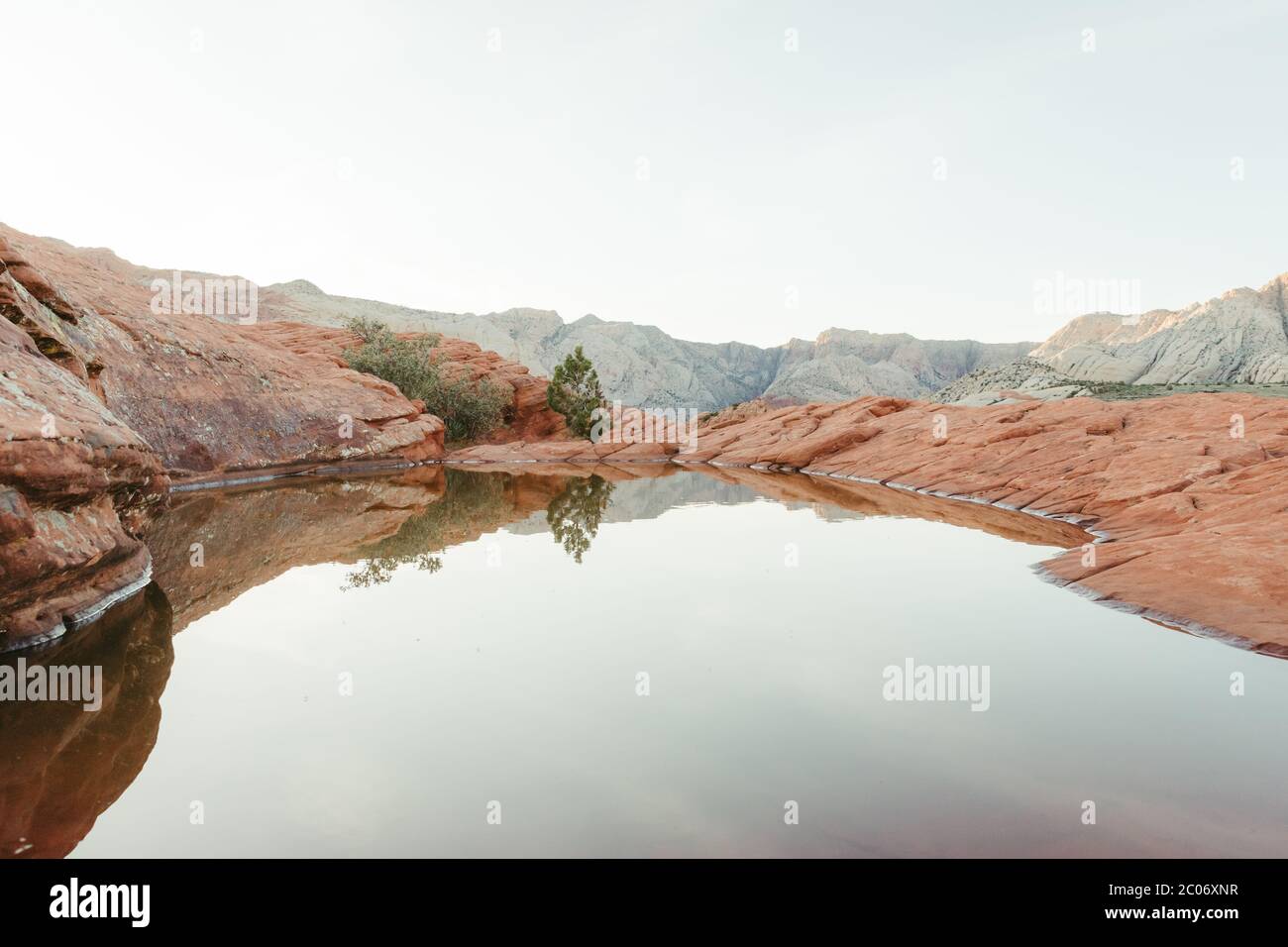 line of reflection from rare pool of water in utah desert after rain ...