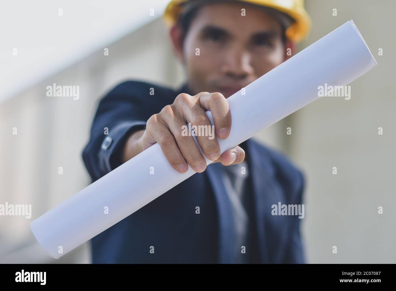 businessman holding blueprint building estate construction Stock Photo ...