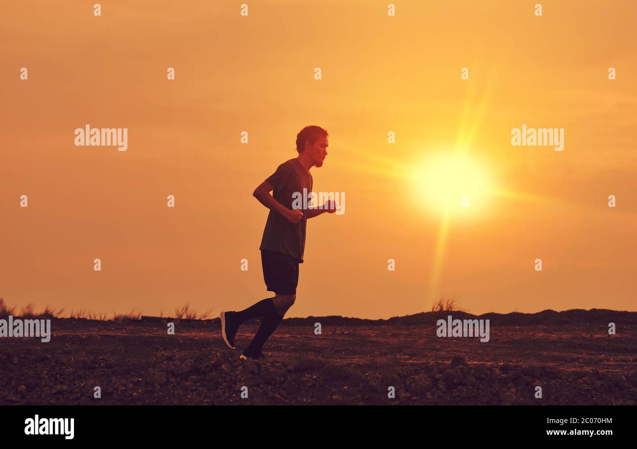 Blurry subject Man running on road sport free run Stock Photo - Alamy