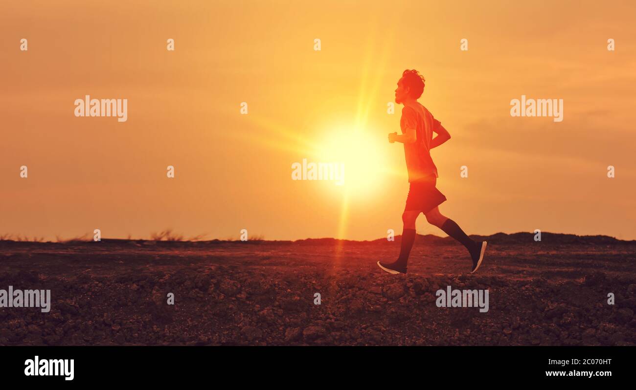 Blurry subject Man running on road sport free run Stock Photo - Alamy