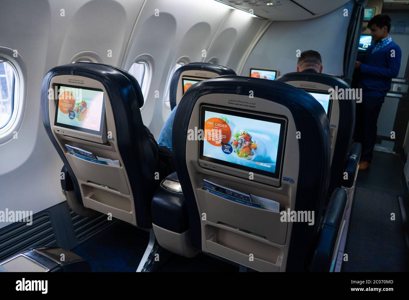 The interior of the aircraft. Empty airplane cabin. Rows of passenger ...
