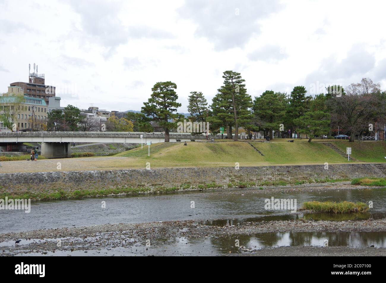 Kyoto, Japan - Dec 7, 2018: Artificial triangle island with trees on ...