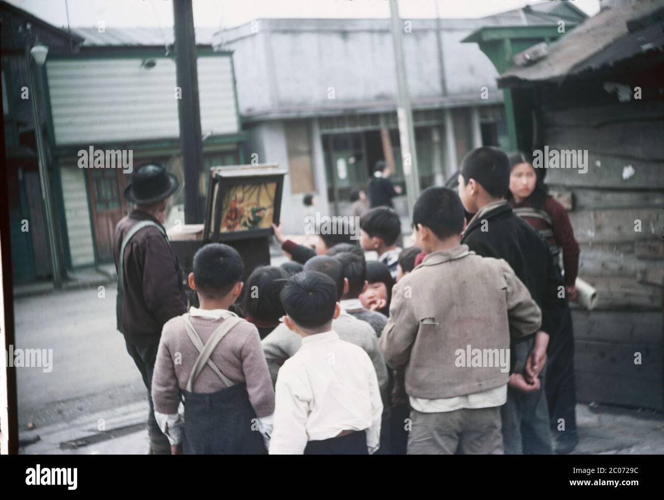 [ 1950s Japan - Kamishibai Story Teller ] — Japanese children watch a ...