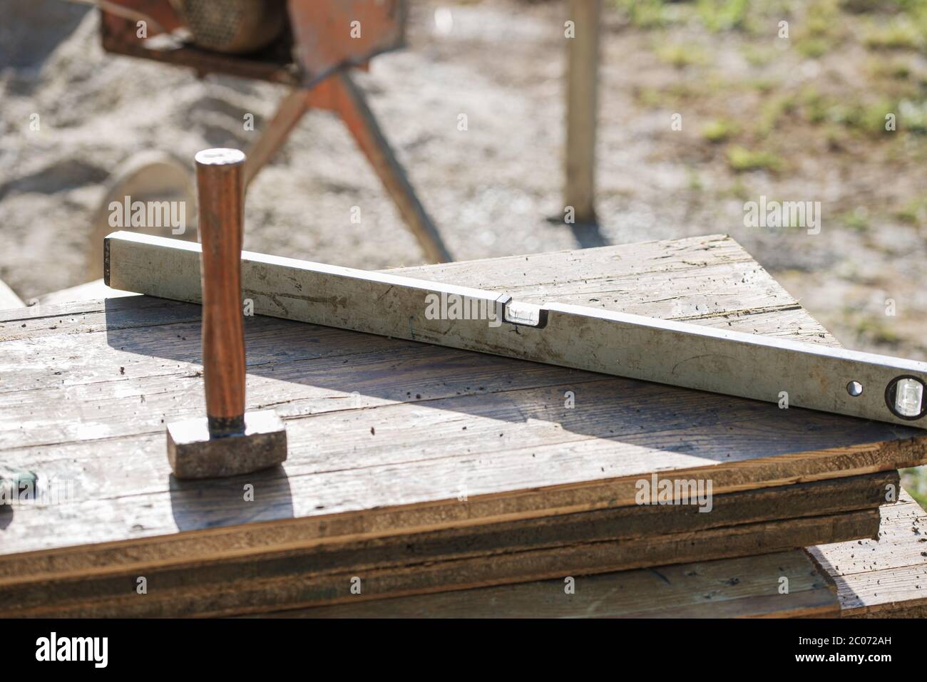 Hammer and measuring label tool on stack of wooden pallets in a ...