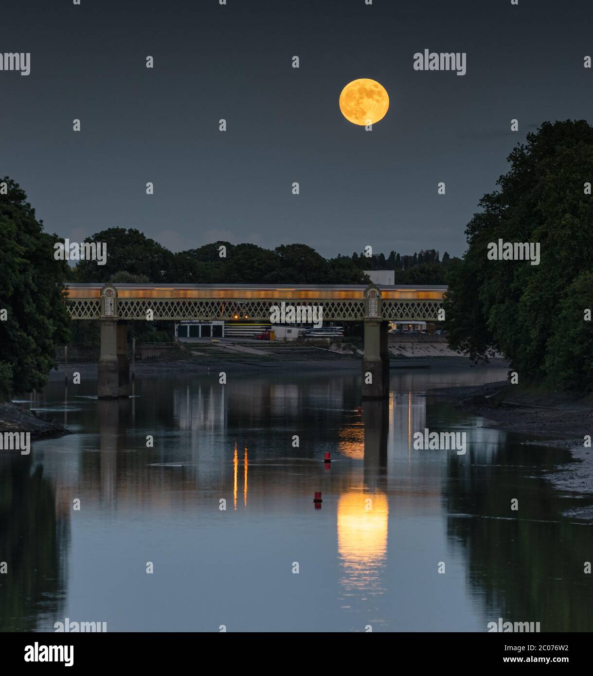 Reflection of supermoon in water hi-res stock photography and images ...