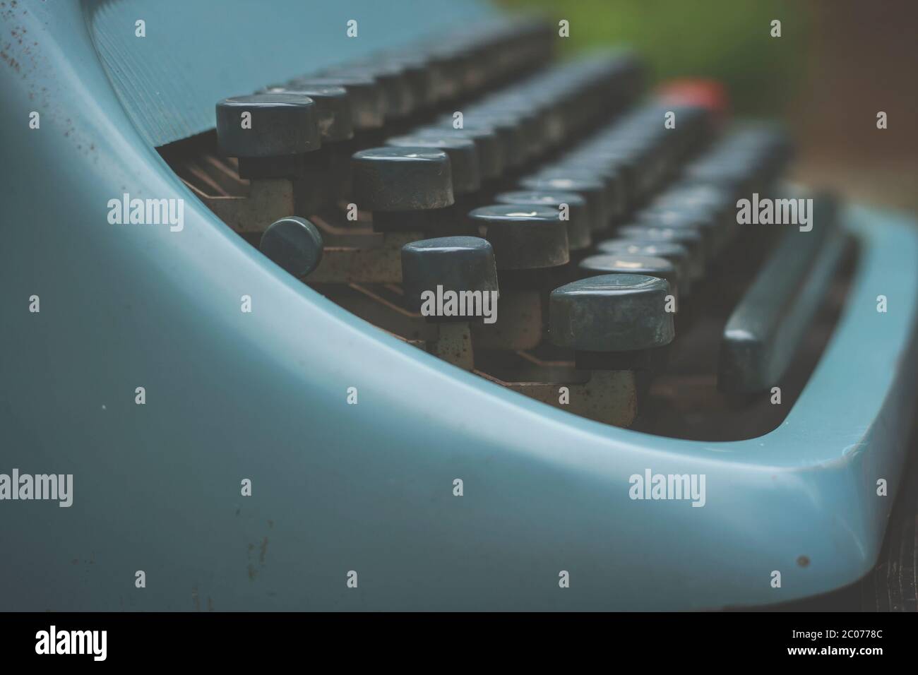 Detail of old vintage blue typewriter Stock Photo - Alamy