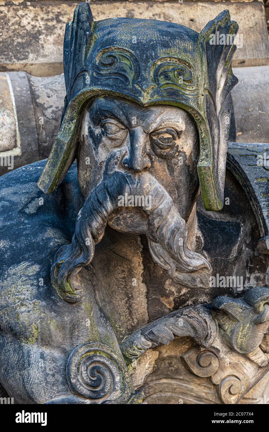 Ancient statute of scary, fearfull and heavy armed gatekeeper, medieval ...