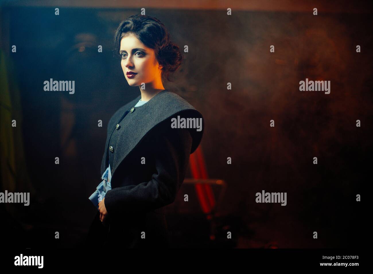 Beautiful female as actress with camera Stock Photo - Alamy