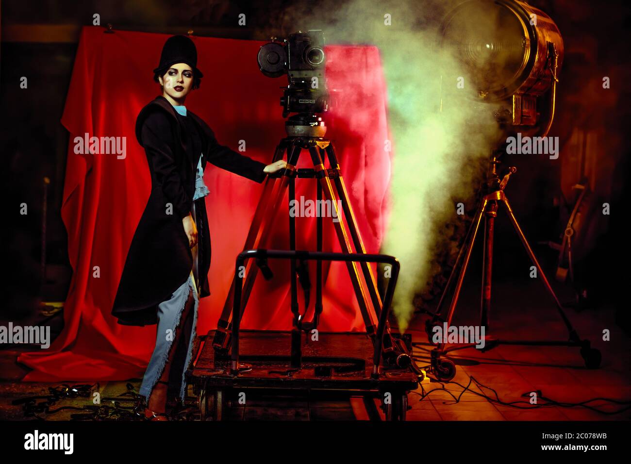 Beautiful female as actress with camera Stock Photo - Alamy