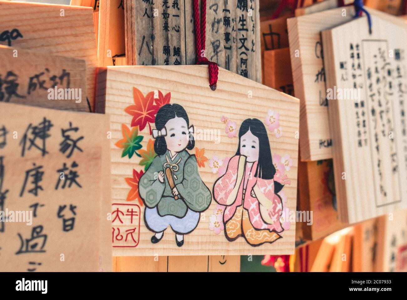 Decorative Japanese tables with personal wishes hanged at a temple ...