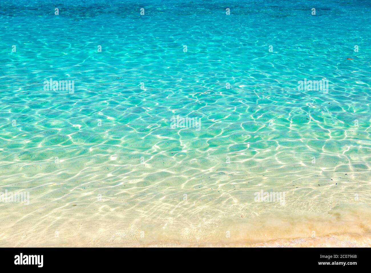 Clear water reflections on shallow sandy beach bottom, Thailand in a ...