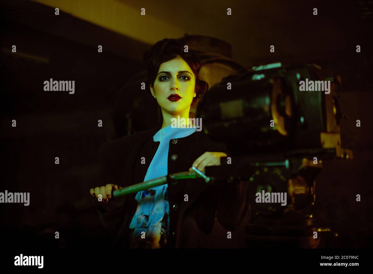 Beautiful female as actress with camera Stock Photo - Alamy