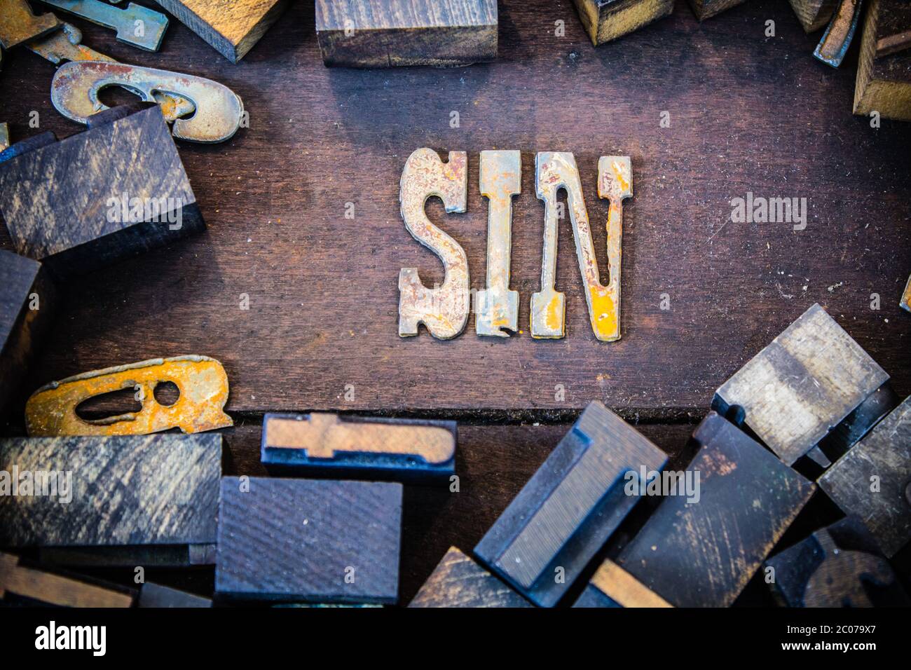 Sin Concept Rusty Type Stock Photo - Alamy