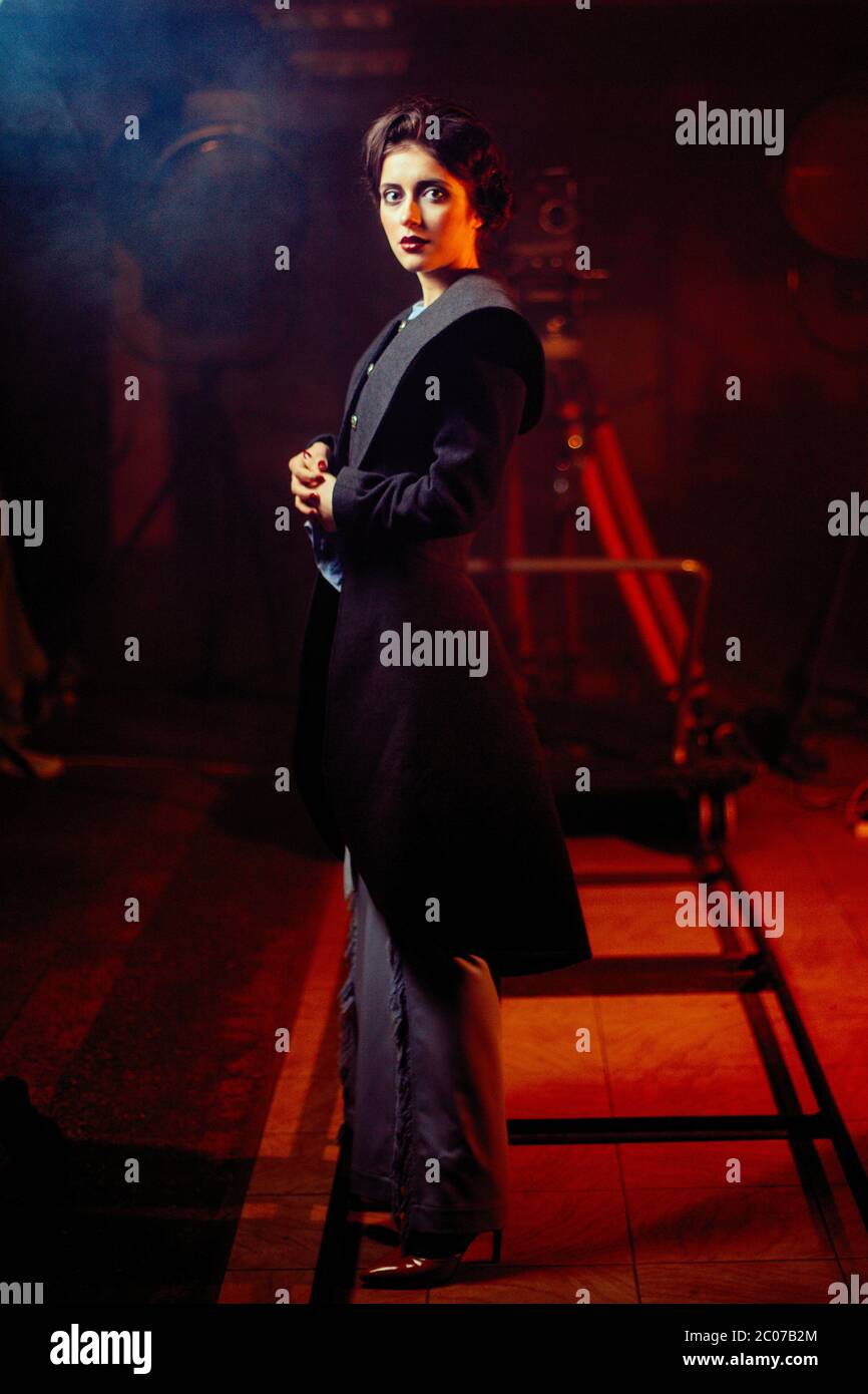 Beautiful female as actress with camera Stock Photo - Alamy