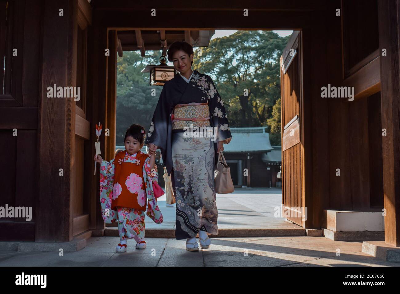 Girls wearing traditional kimonos in the temple hi-res stock ...