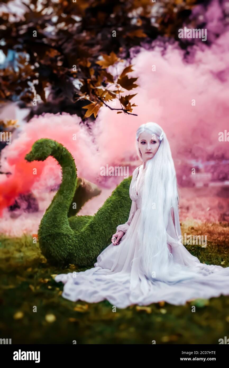 Beautiful woman with topiary bushes Stock Photo - Alamy