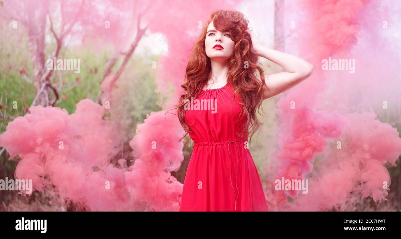 red hair woman wearing dress surrounded by smoke Stock Photo - Alamy
