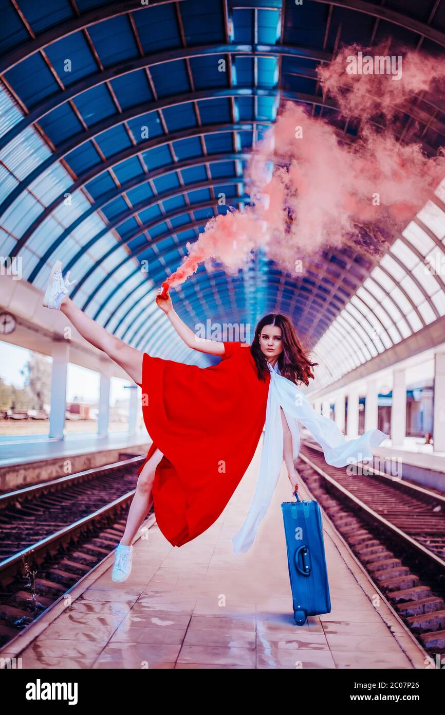 Beautiful woman at the train station Stock Photo - Alamy