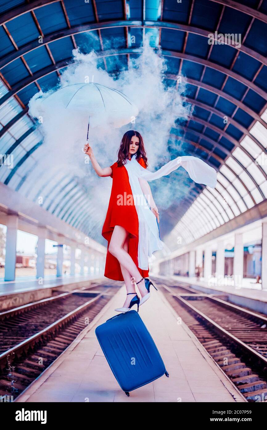 Beautiful woman at the train station Stock Photo - Alamy