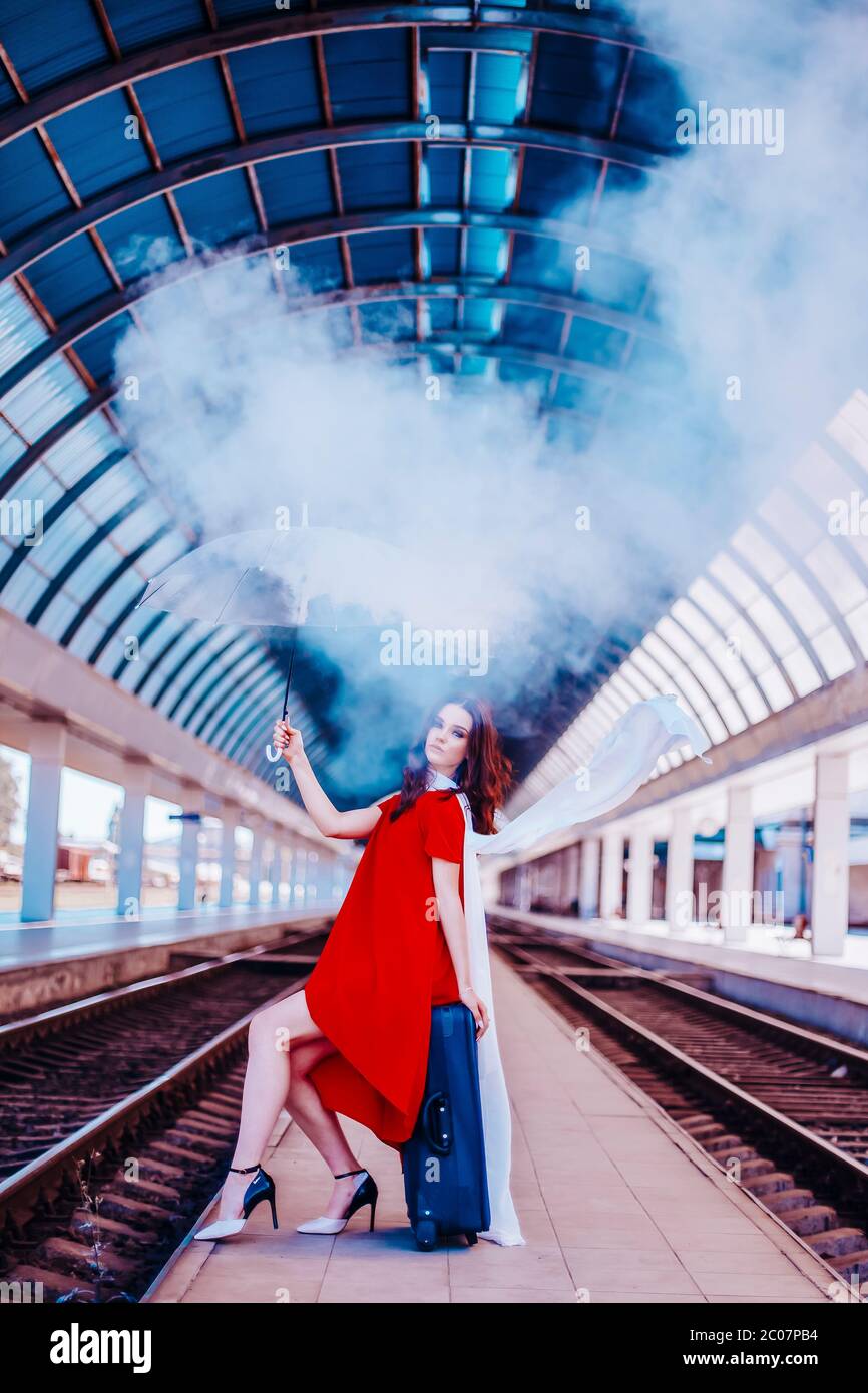 Beautiful woman at the train station Stock Photo - Alamy