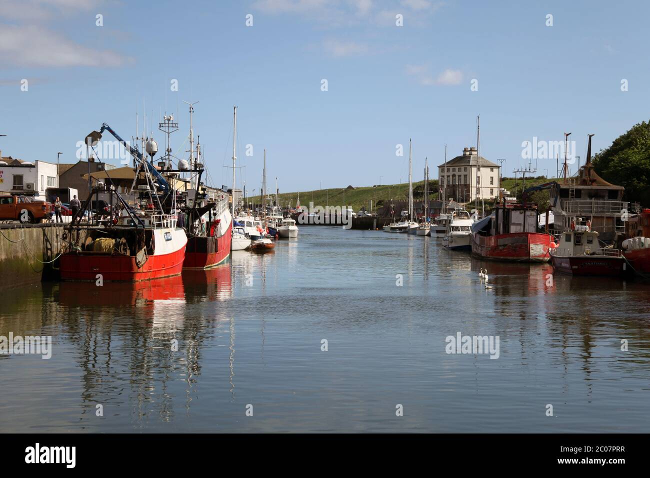 Fishing Boats on Eyemouth Harbour water, Gunsgreen House in the ...