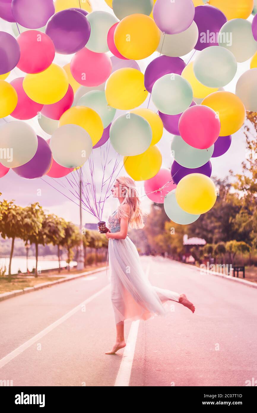 Woman balloons summer birthday hi-res stock photography and images - Alamy