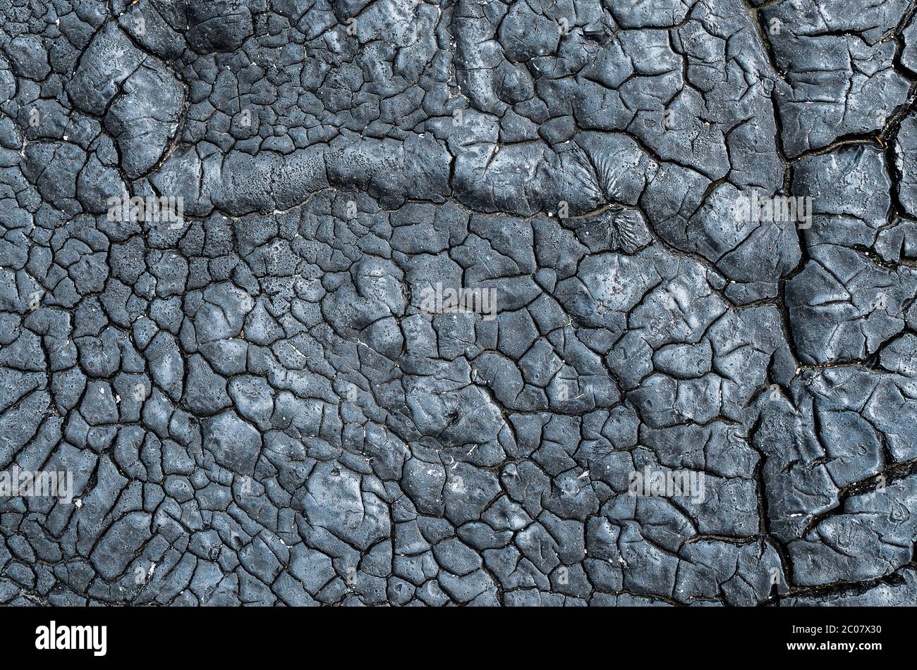 Texture of the dried tar, fuel oil on the roof of the industrial ...