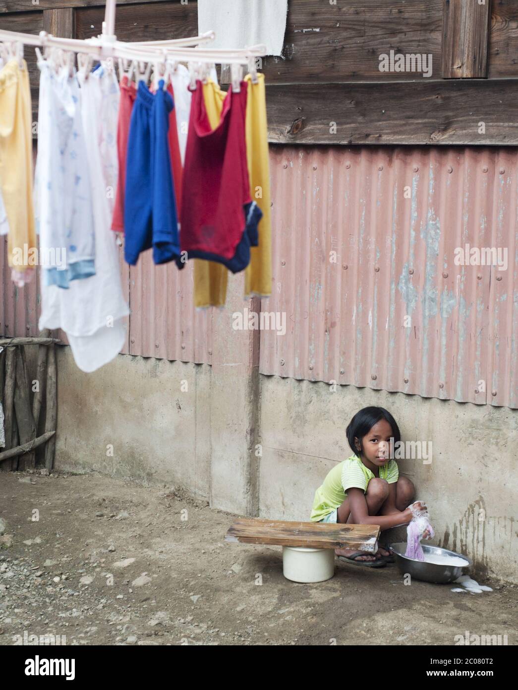 Girl Washing Clothes High Resolution Stock Photography and Images - Alamy