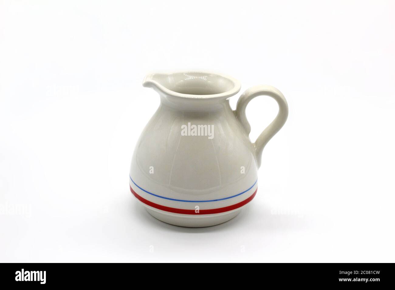 Milk pot, isolated on a white background Stock Photo - Alamy