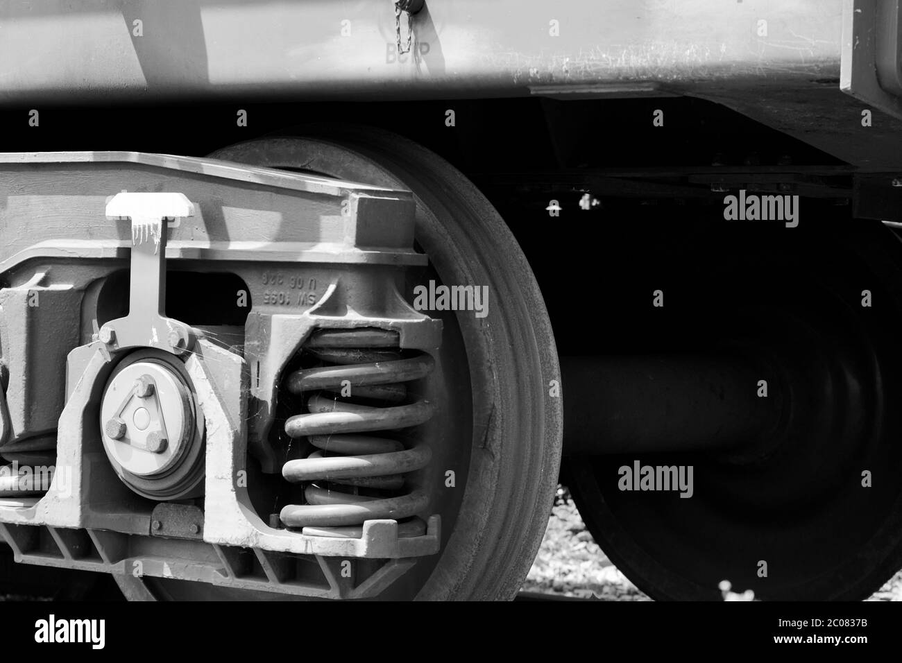 Vintage victorian railway track with huge train wheels in close up ...
