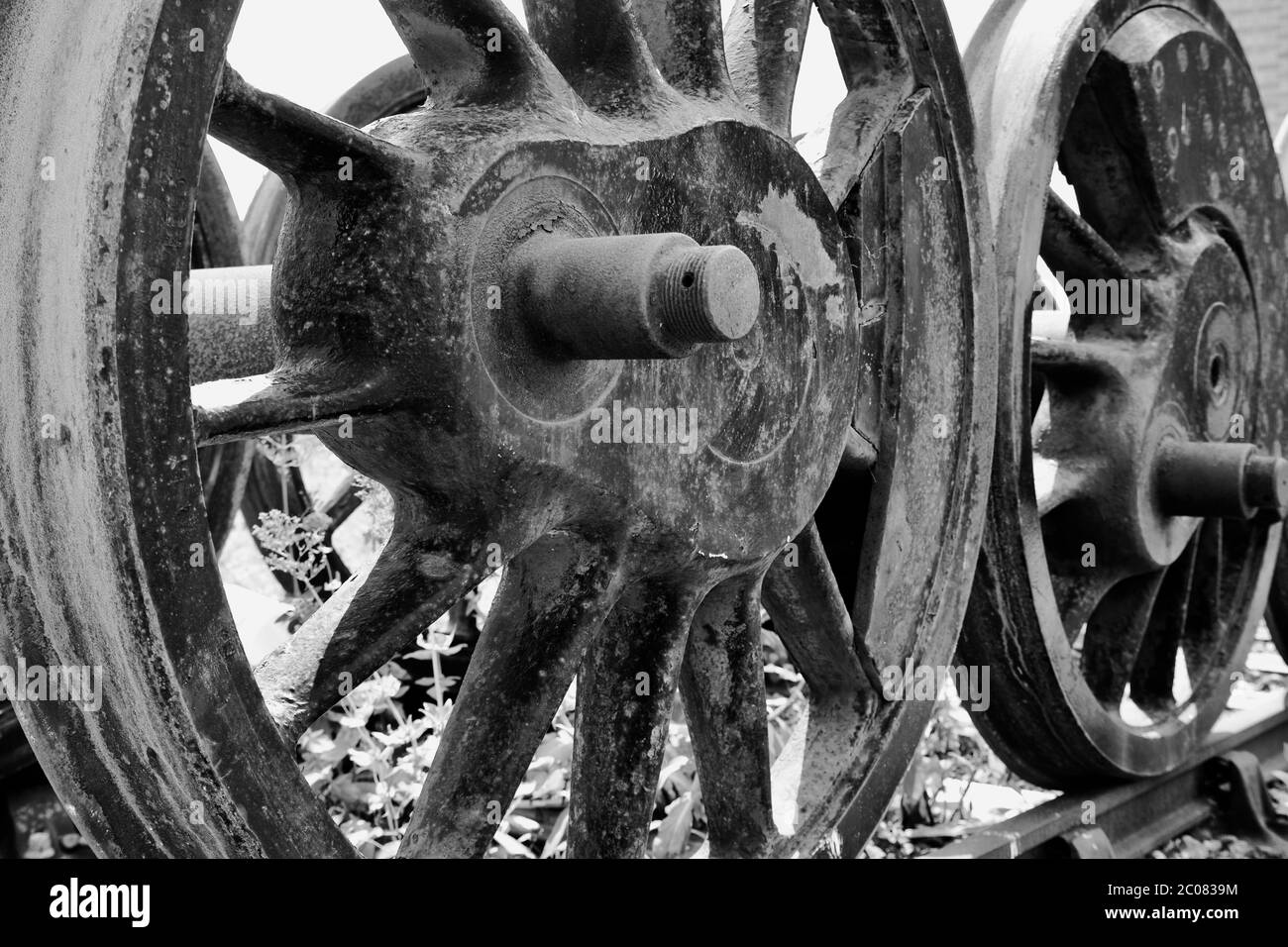 Vintage victorian railway track with huge train wheels in close up ...