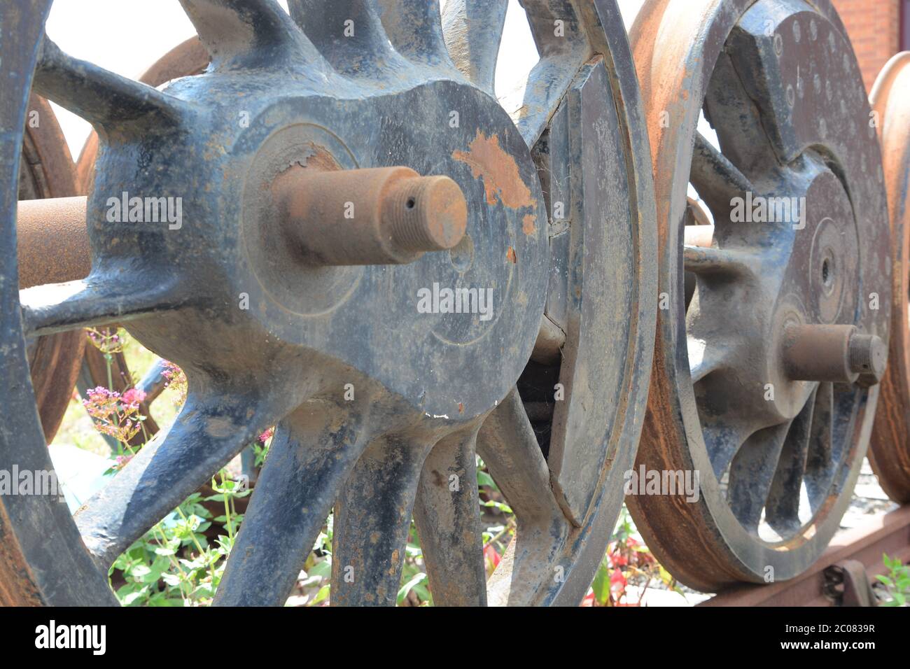 Vintage victorian railway track with huge train wheels in close up ...