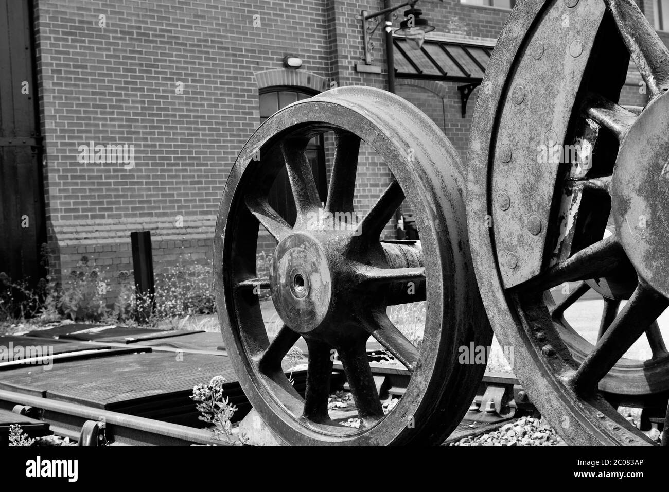 Vintage victorian railway track with huge train wheels in close up ...