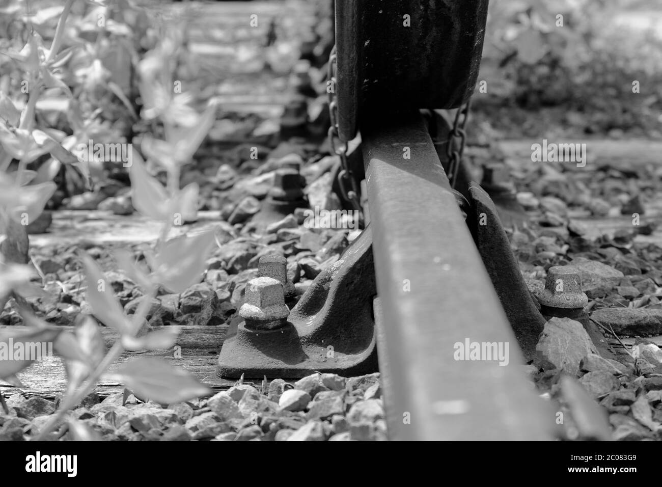 Vintage victorian railway track with huge train wheels in close up ...