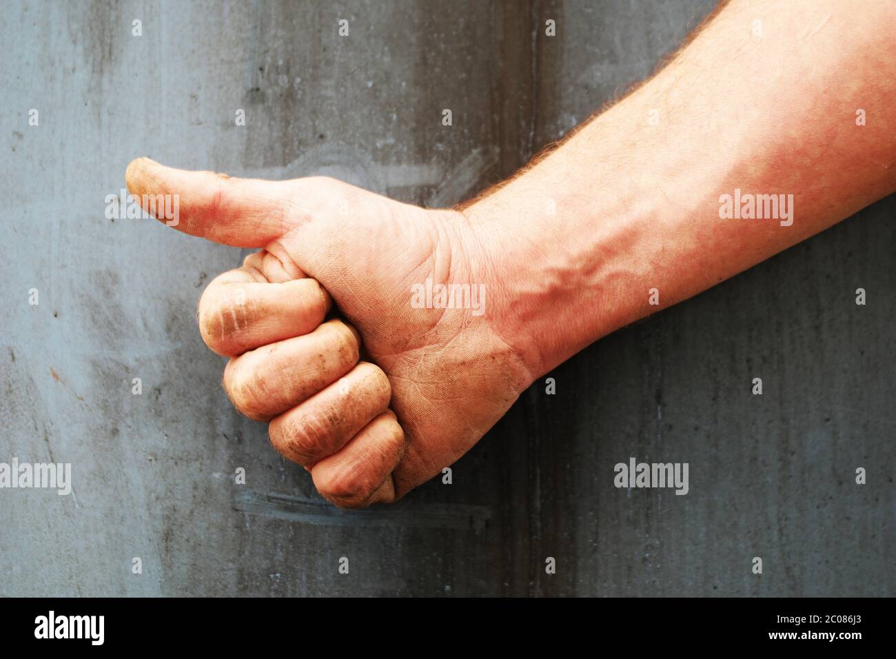 Male right hand showing thumbs up Stock Photo - Alamy