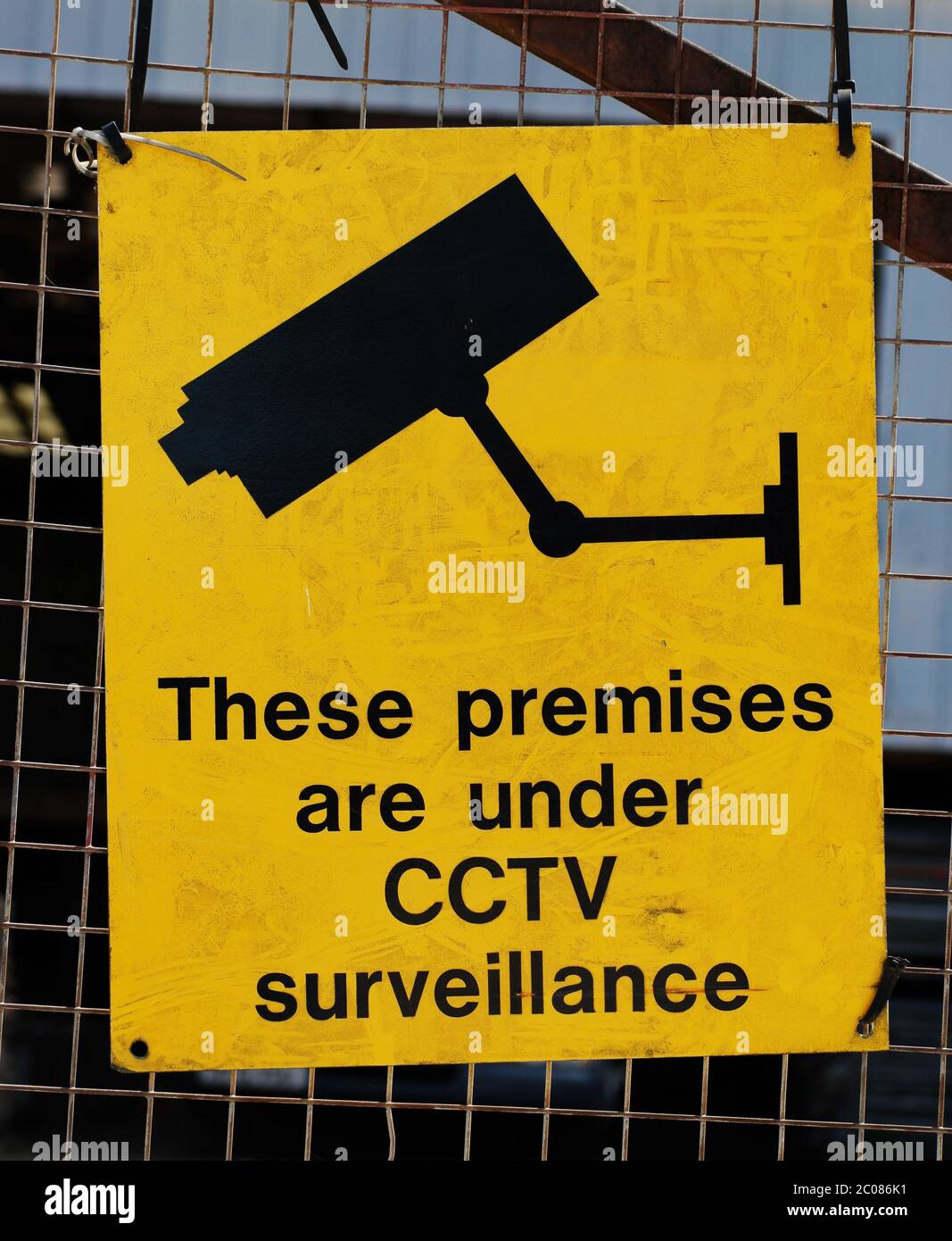 Yellow warning sign for CCTV surveillance Stock Photo - Alamy