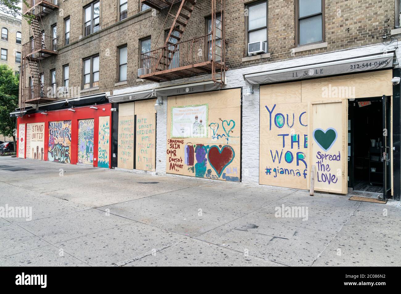 New York, NY - June 11, 2020: Local graffiti artists painted murals on ...