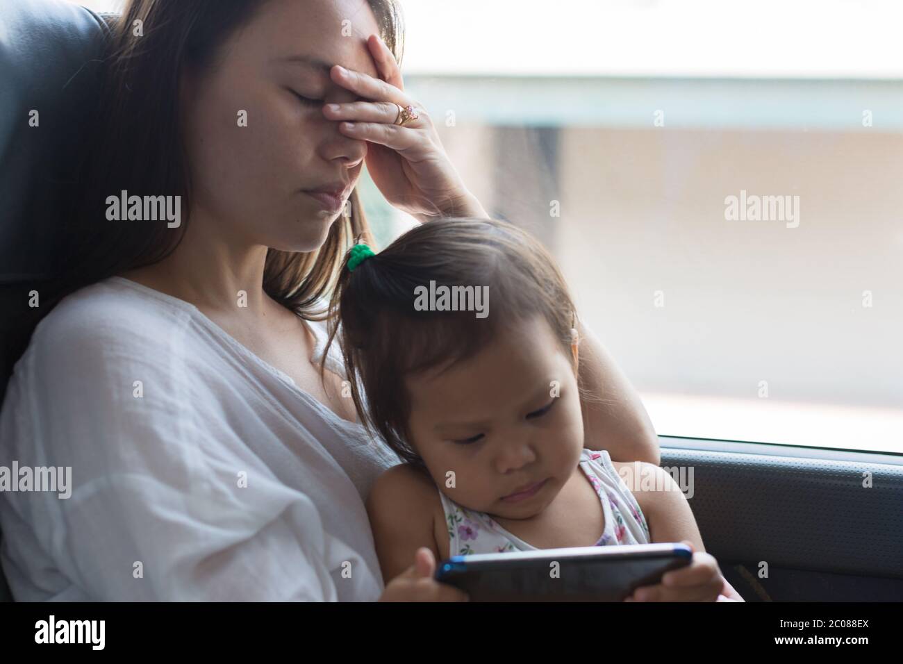 Stressed traveling theme. Long exhausting trips with children. Young ...