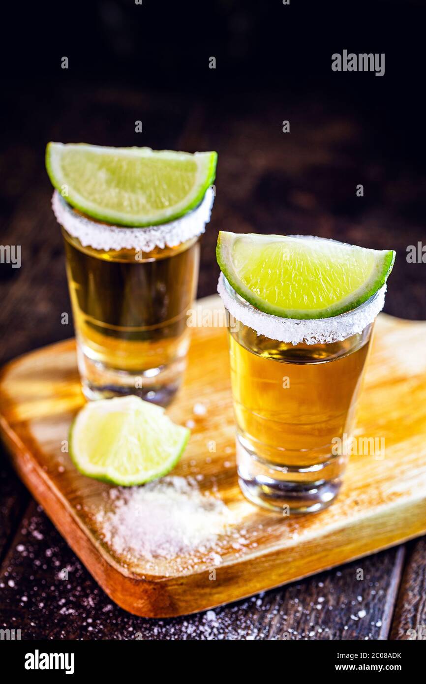 glasses of tequila, with lemon and salt. drink originating in mexico ...