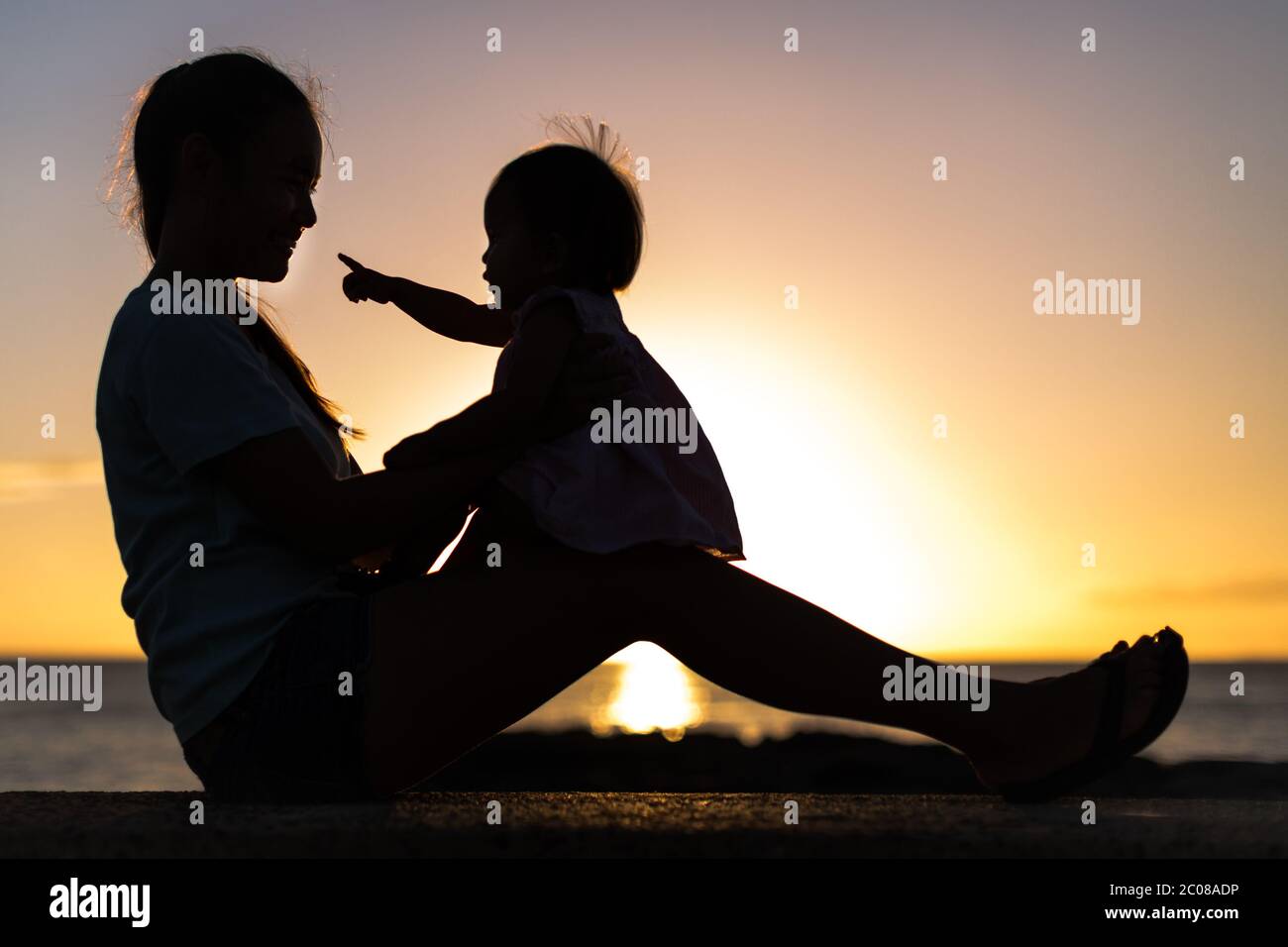 Sitting on mothers lap hi-res stock photography and images - Alamy Sitting on mothers lap hi-res stock photography and images - Alamy