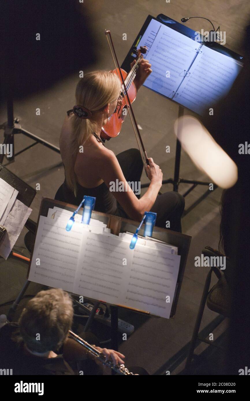 Overhead view of flute and viola player (model released) in concert ...