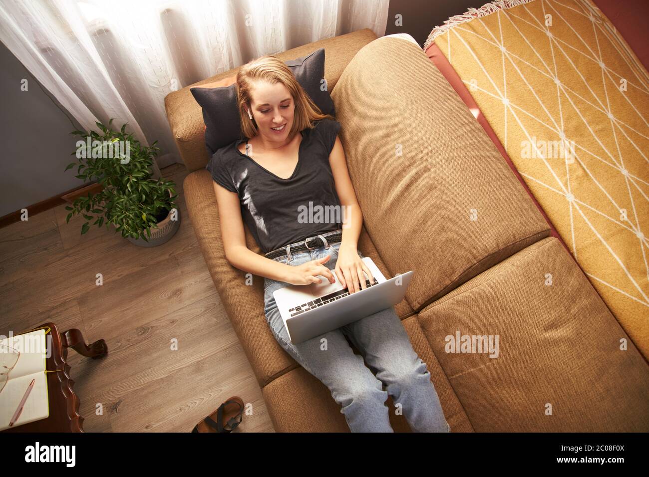Female working sofa hi-res stock photography and images - Alamy