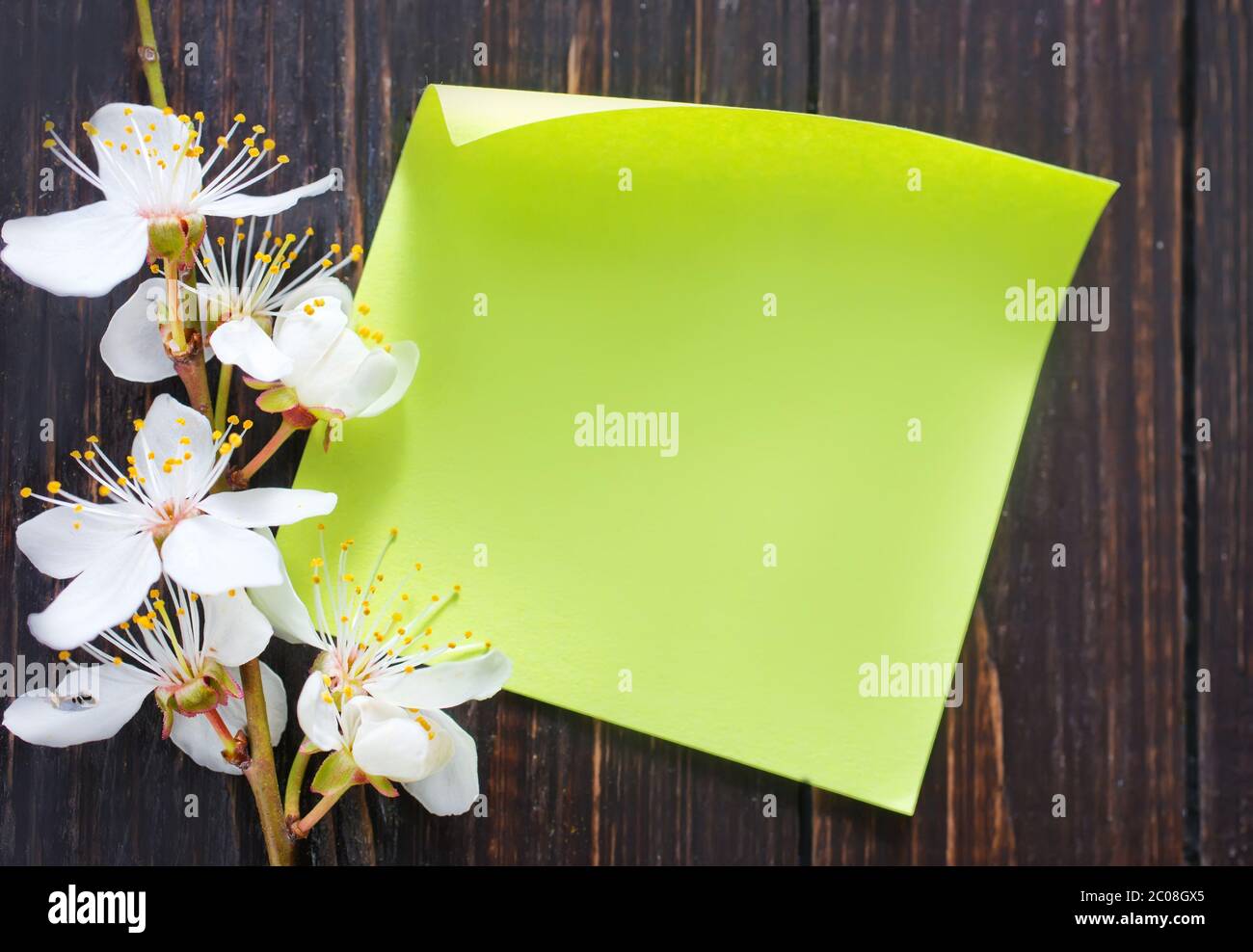 flowers and paper on wooden background Stock Photo - Alamy